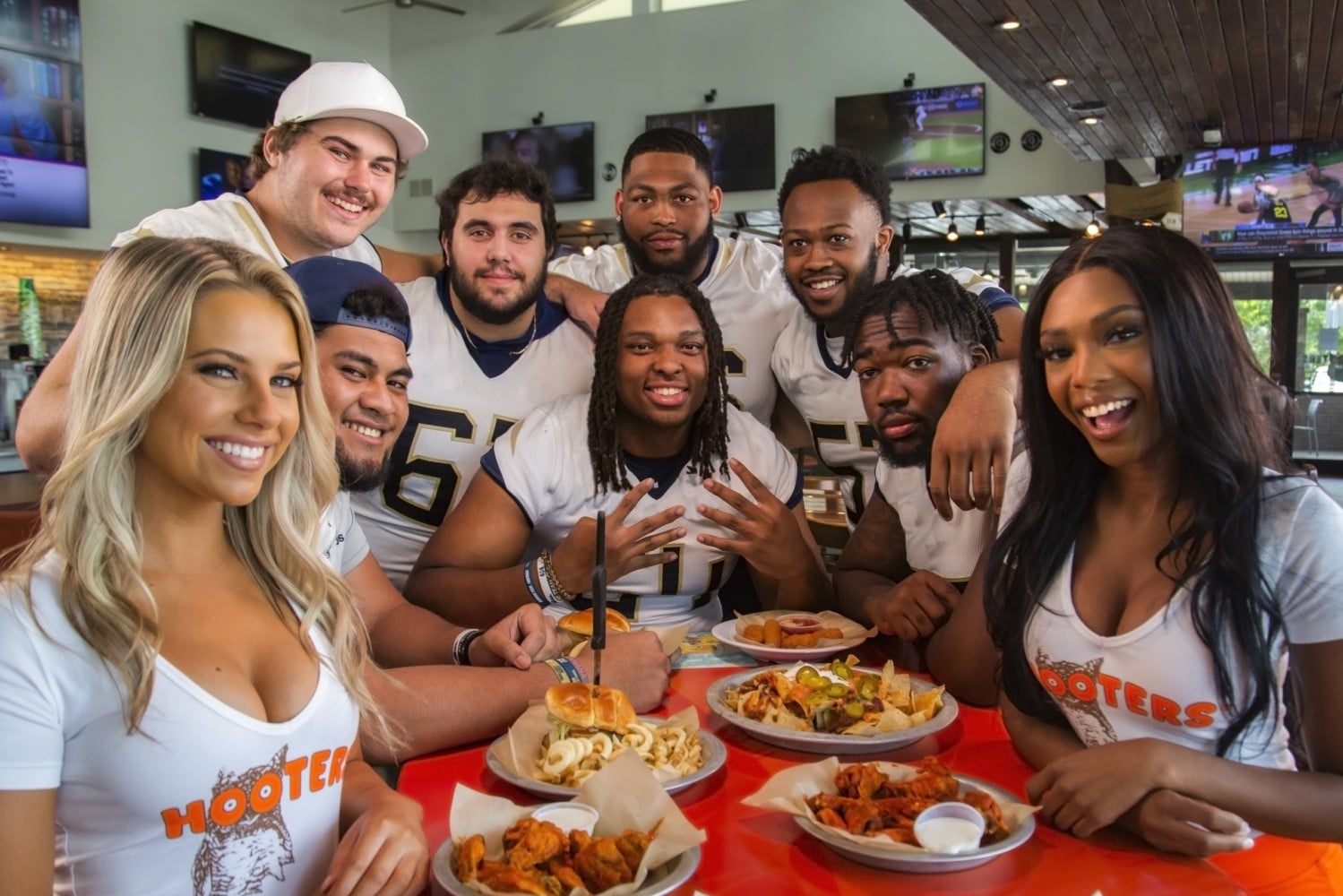 Hooters Signs 51 College Football Offensive Linemen to NIL Deals